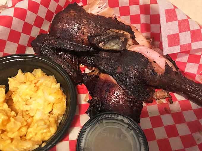 Smoke-kissed chicken with that perfect mahogany skin. The mac and cheese alongside isn't just a side—it's a co-star.