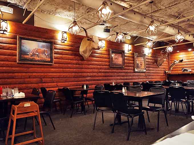 Antler chandeliers cast a warm glow over tables where memories are made one bite at a time. Rustic elegance at its finest.