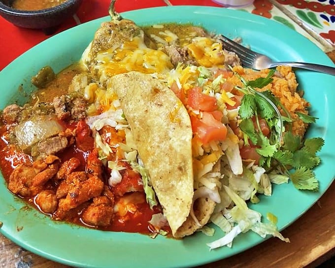 A combination plate that solves the eternal "I want everything" dilemma. Enchilada, taco, and chile-smothered delights sharing a plate like old friends at a reunion.