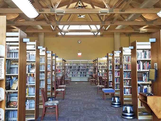 Harrisville's library combines warm wooden beams with natural light, creating a sanctuary where time slows and browsing isn't just for online shopping.