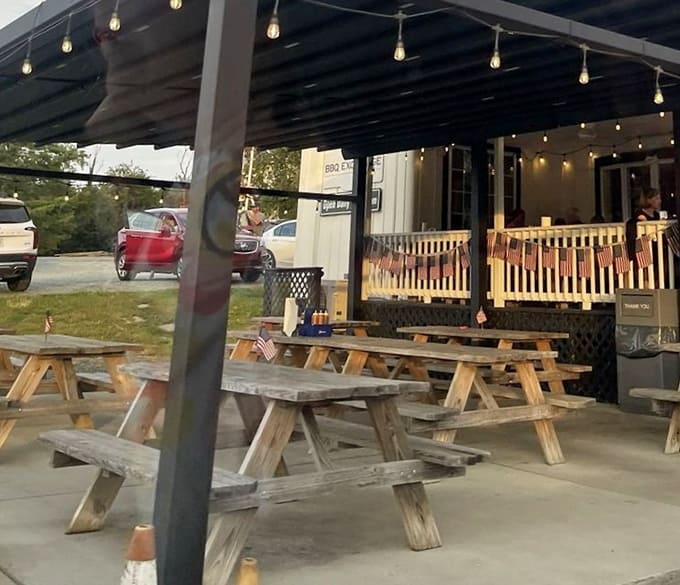 Outdoor seating where the fresh air somehow makes everything taste even better. String lights add ambiance as the sun sets on happy diners.