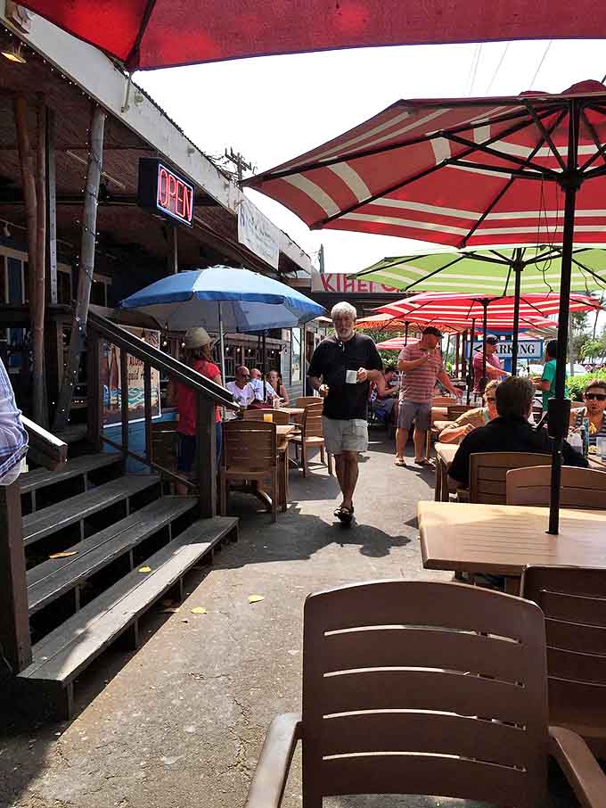 The outdoor patio&mdash;where breakfast dreams come true under striped umbrellas. Morning conversations flow as freely as the coffee refills.