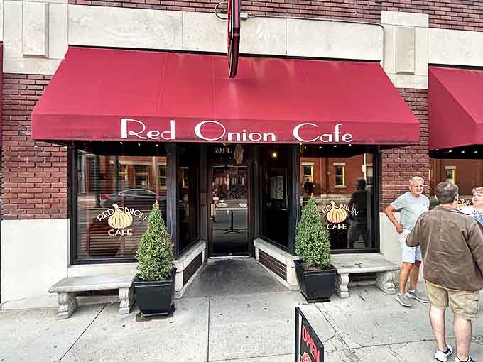 Red Onion Cafe's inviting storefront promises comfort food with creative twists, where locals linger over coffee and retirement plans.