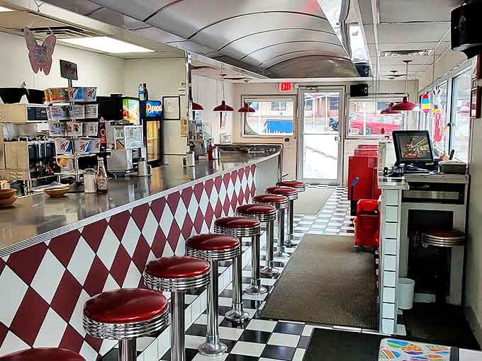 The counter where strangers become friends over coffee. Those red stools have heard more stories than most therapists&mdash;and the coffee's better too.