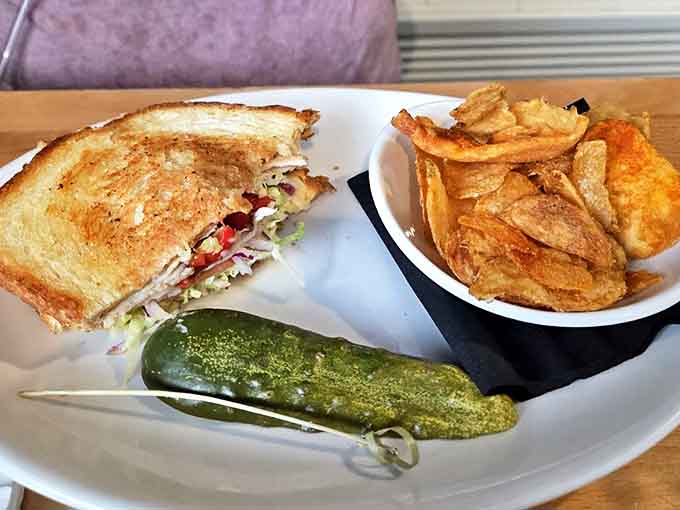 Half-eaten is the highest compliment&mdash;this sandwich was clearly too good to wait for a photo, with house-made chips providing the perfect crunchy counterpoint.