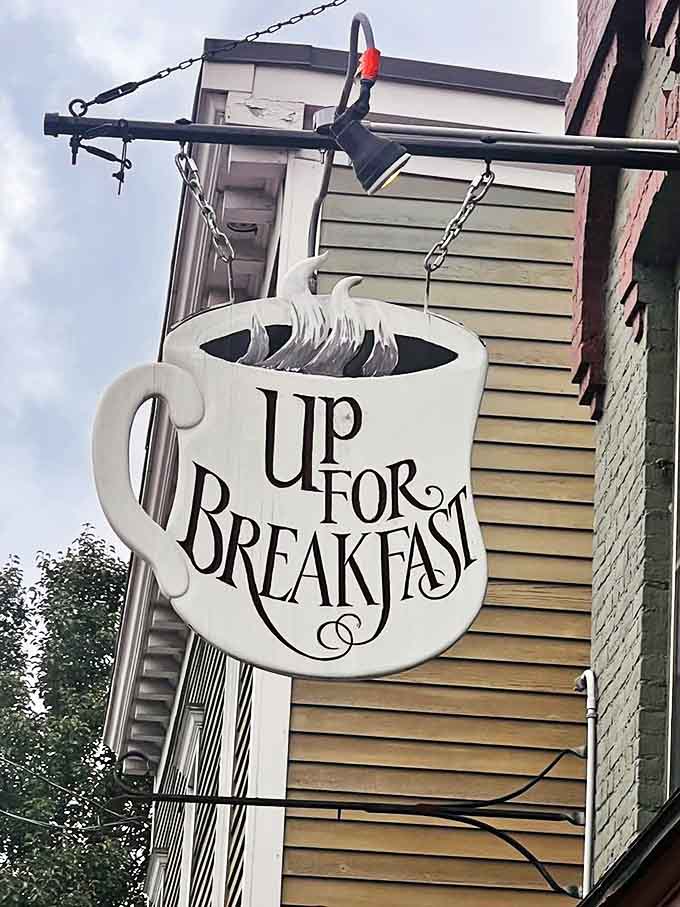 The iconic coffee cup sign swinging gently in the Vermont breeze&mdash;a beacon of breakfast hope that's impossible to resist.