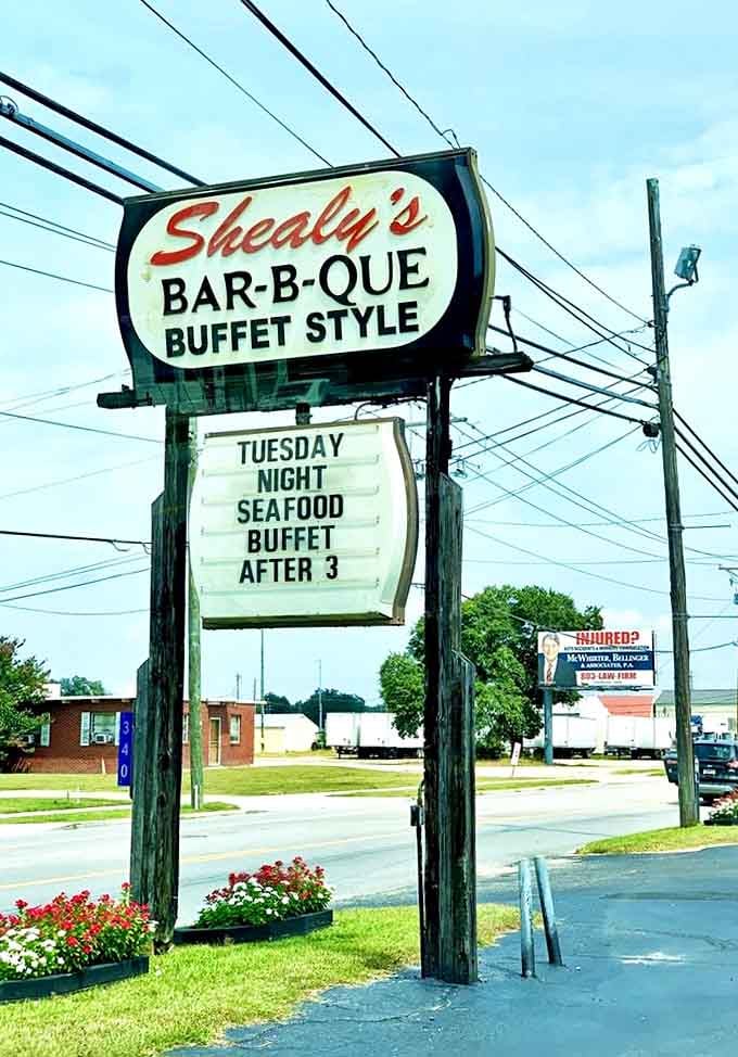 The roadside sign stands as a beacon of hope for hungry travelers, promising buffet-style salvation just off the highway.