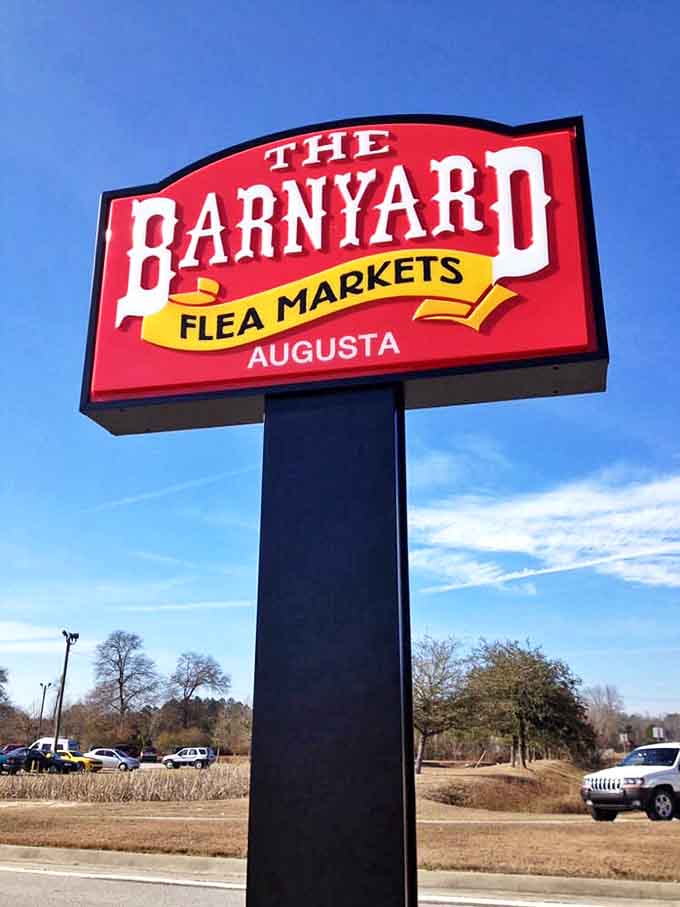 The Barnyard's roadside sign stands tall against the Georgia sky, a beacon for bargain hunters and collectors alike.