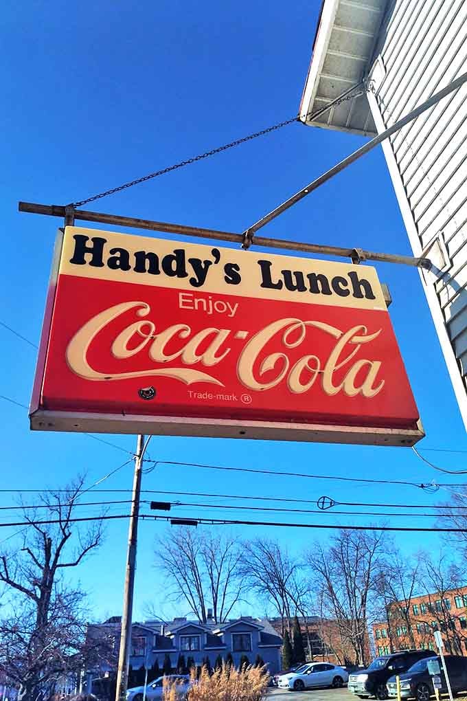 That vintage Coca-Cola sign has probably guided more hungry travelers than any GPS ever could, hanging proudly against Vermont's blue sky.