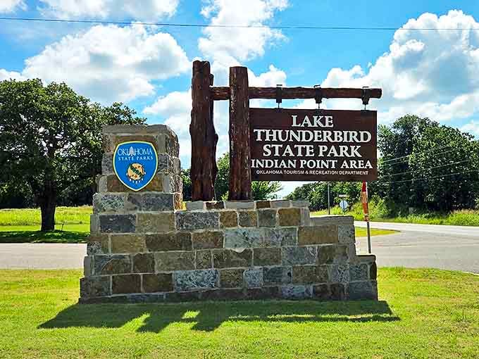 The entrance sign that marks the boundary between everyday worries and the promise of lakeside relaxation just beyond.