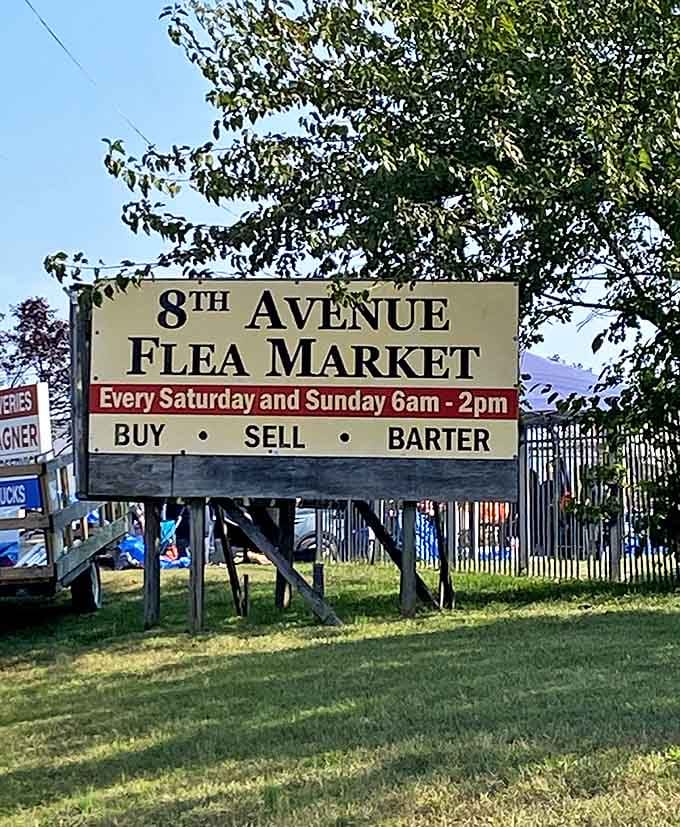 The gateway to weekend adventure. Every Saturday and Sunday, 6am-2pm, this sign beckons bargain hunters to buy, sell, or barter.