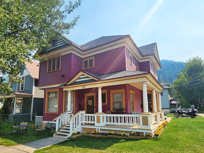 The vibrant purple Victorian B&B stands as a colorful counterpoint to Wallace's brick buildings. Its welcoming porch promises rocking chairs and mountain views.