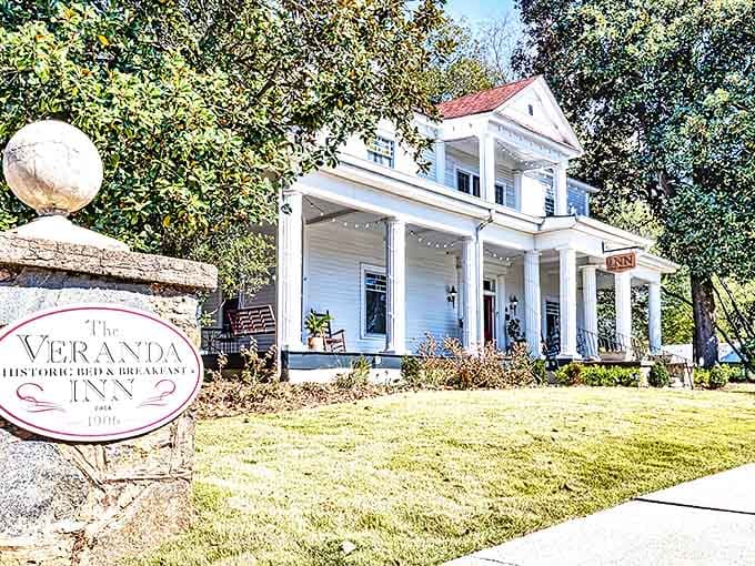 The Veranda Historic Inn embodies Southern hospitality with its classic white columns and inviting porch, promising a peaceful retreat in historic Senoia.