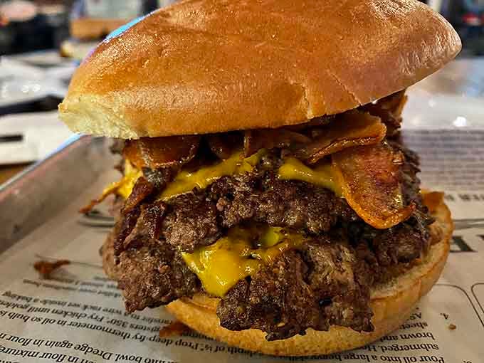 This isn't just a burger&mdash;it's a towering monument to indulgence, where melted cheese cascades over beef and bacon like a delicious waterfall.