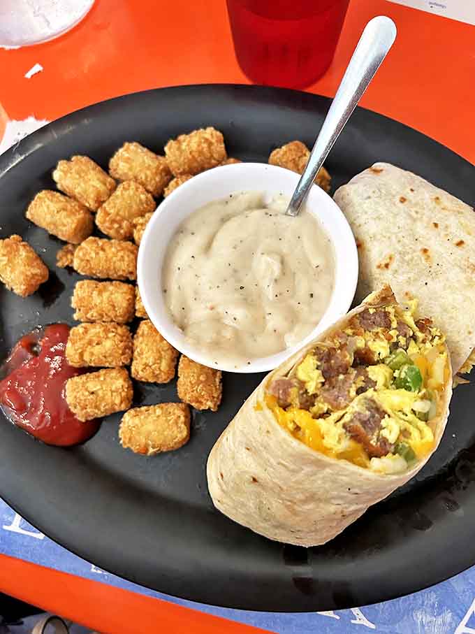 Breakfast burrito with a side of tots&mdash;because sometimes you need your morning wrapped up neat, tidy, and ready for dipping adventures.