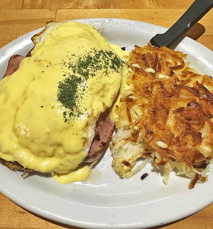 Eggs Benedict reimagined with a golden hollandaise cascade that would make Escoffier himself put down his whisk in admiration.