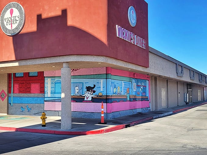 The exterior mural adds a touch of whimsy to the pink-and-beige building &ndash; like a cartoon oasis in the concrete desert.
