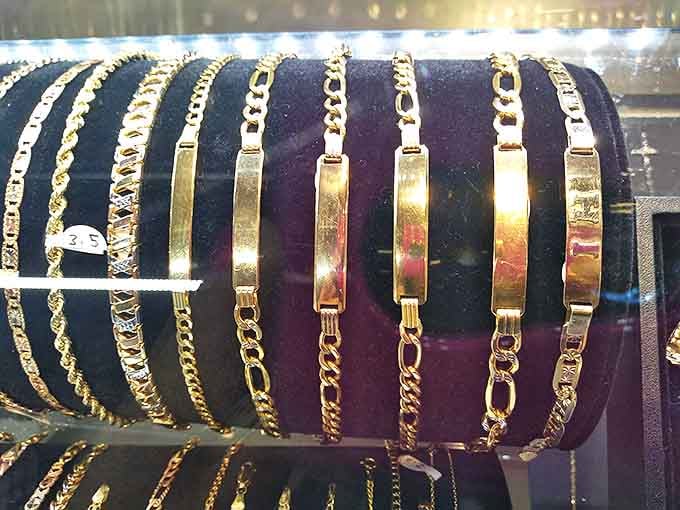 Gold bracelets catching light and attention – everyday luxury that doesn't require explaining to your accountant why you needed "just one more."