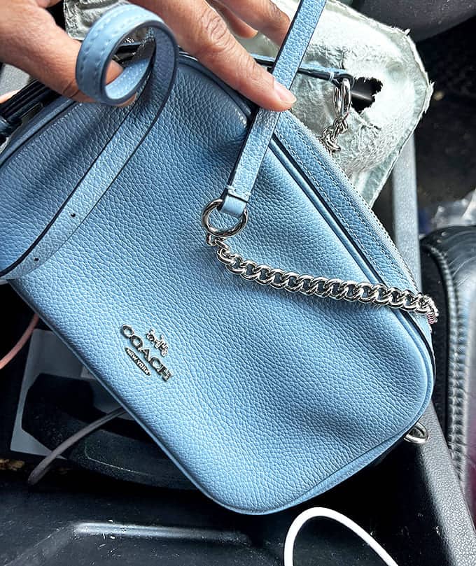Designer discoveries hiding in plain sight – that powder blue Coach bag isn't just an accessory, it's a victory trophy.