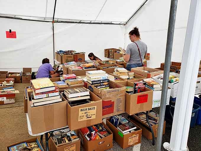 Book sale heaven! These boxes of literary treasures await new homes, proving that the best adventures often begin with a bit of digging.