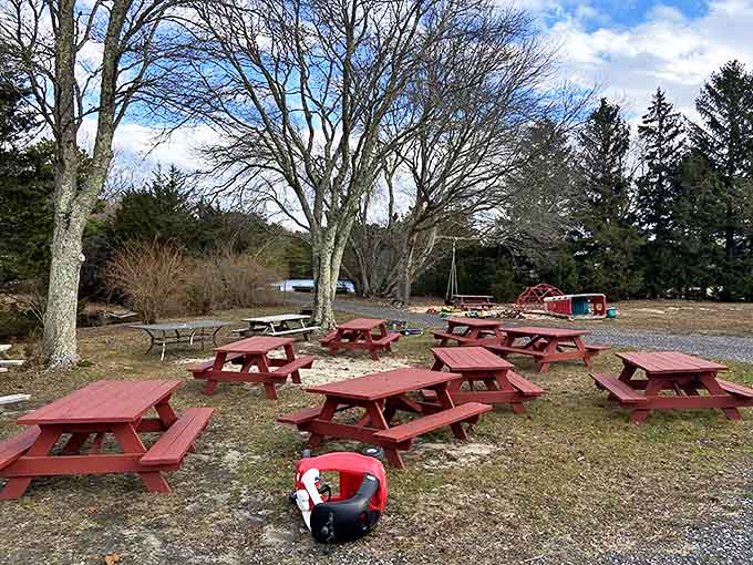 Red picnic tables scattered across the grounds offer a peaceful spot to enjoy your takeout &ndash; country ambiance that enhances every bite.