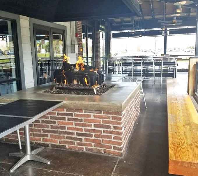 The outdoor fire pit area &ndash; where summer evenings stretch into night and conversations flow as freely as the drinks.