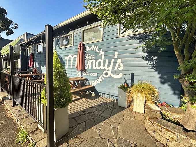 The blue exterior proudly displays the Mandy's name, while picnic tables await outdoor diners. Oregon's fresh air makes everything taste better, especially breakfast.