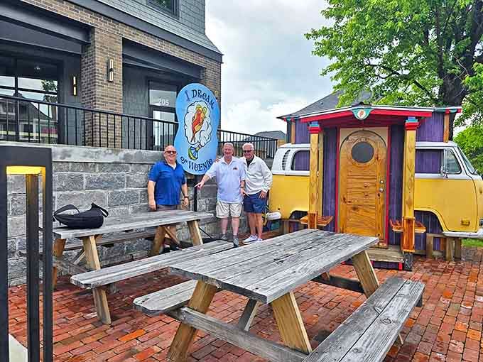 The outdoor seating area offers the authentic I Dream of Weenie experience&mdash;picnic tables, fresh air, and that magical yellow bus in view.