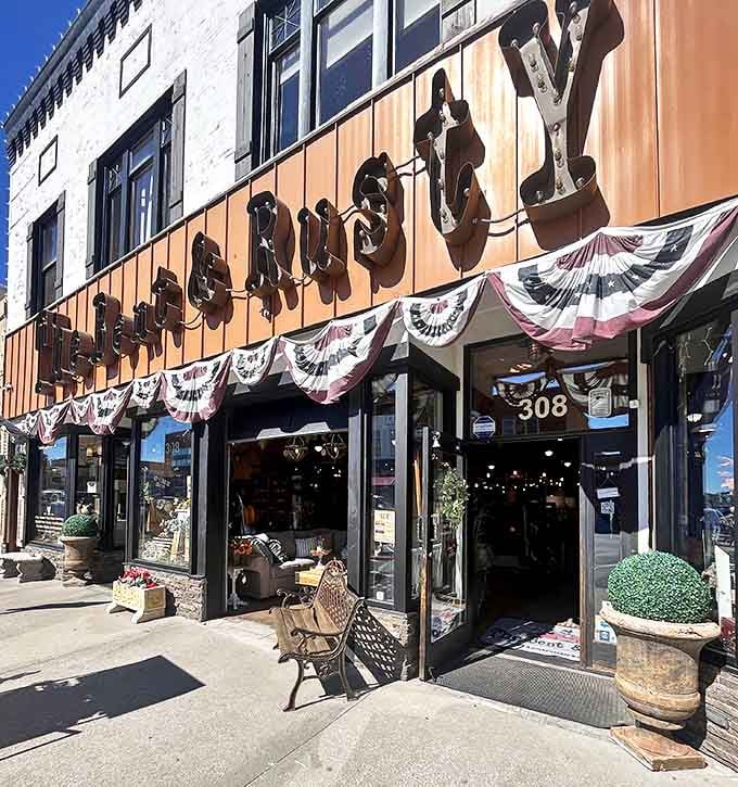 Patriotic decorations and welcoming planters frame the entrance like Wyoming itself is giving you a warm, star-spangled hug.