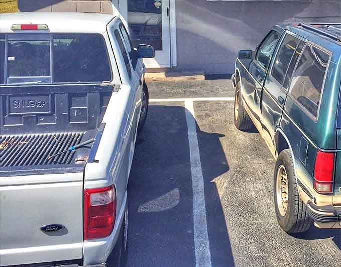 The parking lot fills up fast on Friday and Saturday mornings. These trucks aren't just vehicles—they're barbecue pilgrims on a sacred journey.