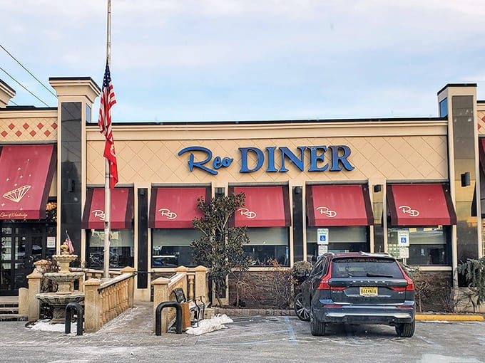 The exterior view that promises comfort inside&mdash;where the Reo Diner stands proud with its American flag, ready to serve another day of Jersey-style hospitality.