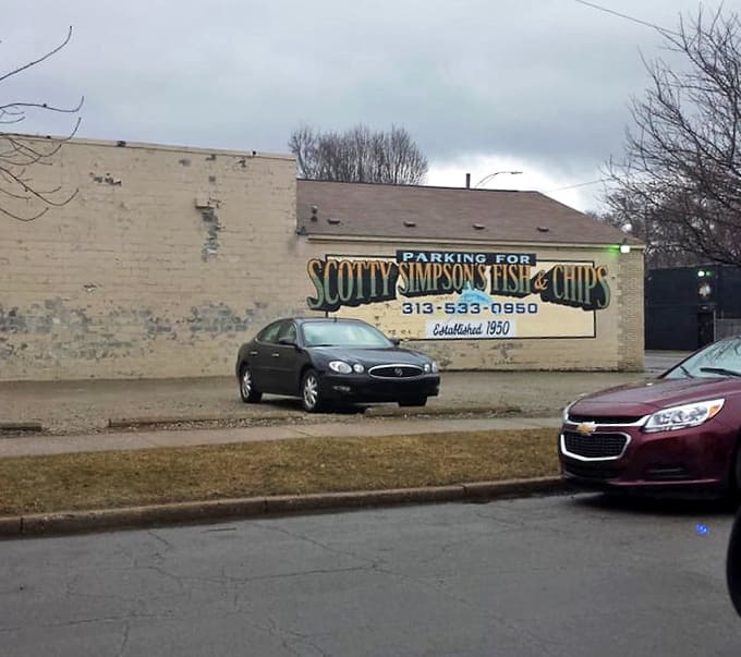 Even the parking sign has that vintage charm, announcing to the neighborhood that some traditions are worth preserving in concrete and neon.