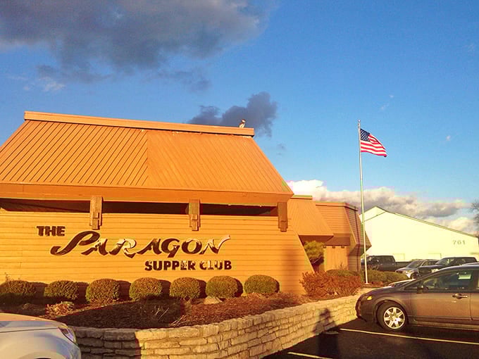 As evening falls, The Paragon's golden exterior glows like a beacon for those seeking refuge from chain restaurant mediocrity.