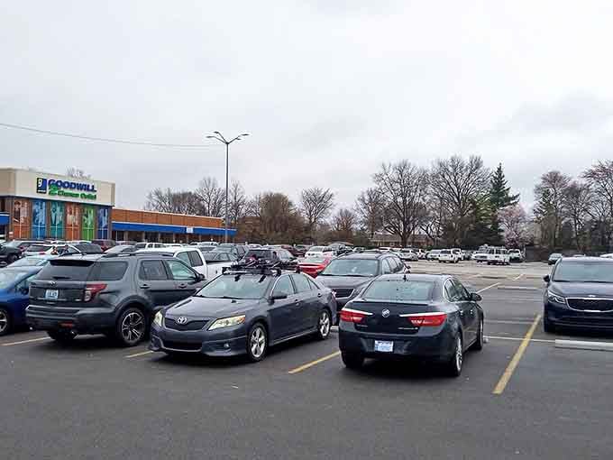 Even the parking lot feels optimistic, each space holding the promise of a vehicle soon to be filled with unexpected treasures.