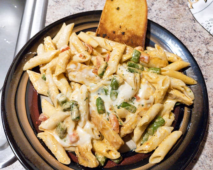 This pasta isn't trying to be Italian &ndash; it's proudly Midwestern comfort food, where cheese and cream sauce are considered essential food groups.