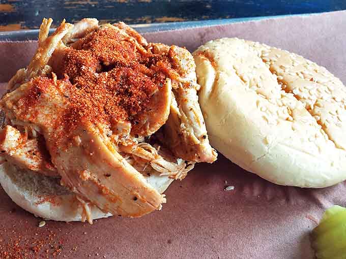 A pulled pork sandwich so generously piled it makes you wonder if there's a structural engineer somewhere in the kitchen.