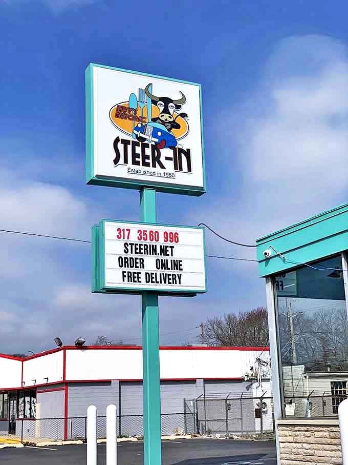 The iconic Steer-In sign stands tall against Indiana skies, a beacon of hope for the hungry and a landmark for generations of east-siders.