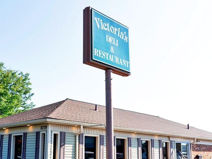 That iconic teal sign stands like a beacon of hope in a world of overpriced small plates. Victoria's isn't just a name—it's a promise of satisfaction.