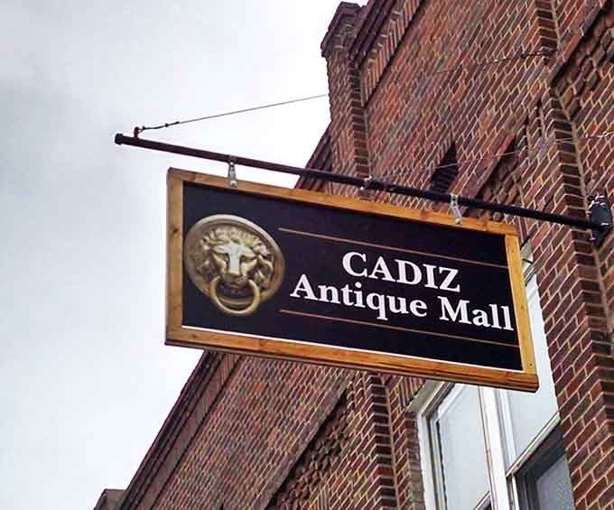 The lion's head knocker on the sign seems to say, "Enter if you dare&mdash;your wallet may never be the same again!"