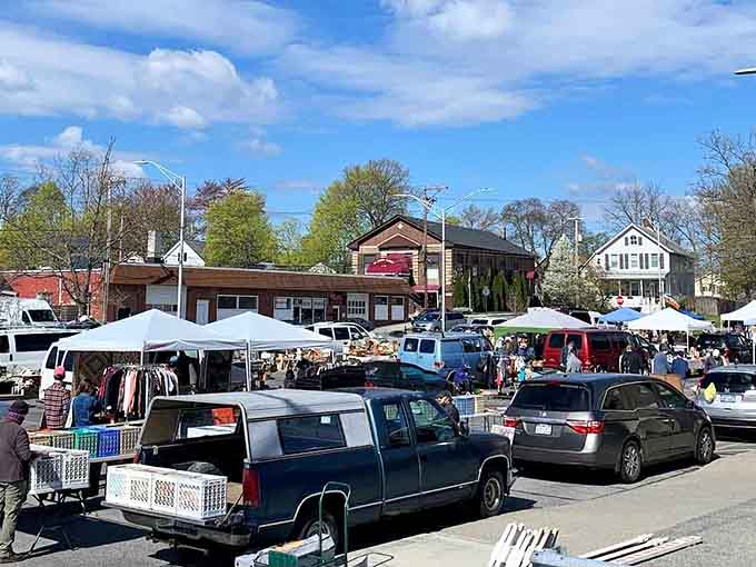 Spring sunshine bathes the market in golden light, turning a simple parking lot into a community celebration of history and haggling.