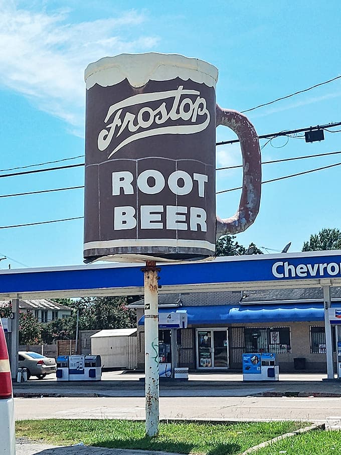The iconic Frostop mug sign stands tall against the sky, a beacon of root beer excellence that's guided hungry travelers for generations.