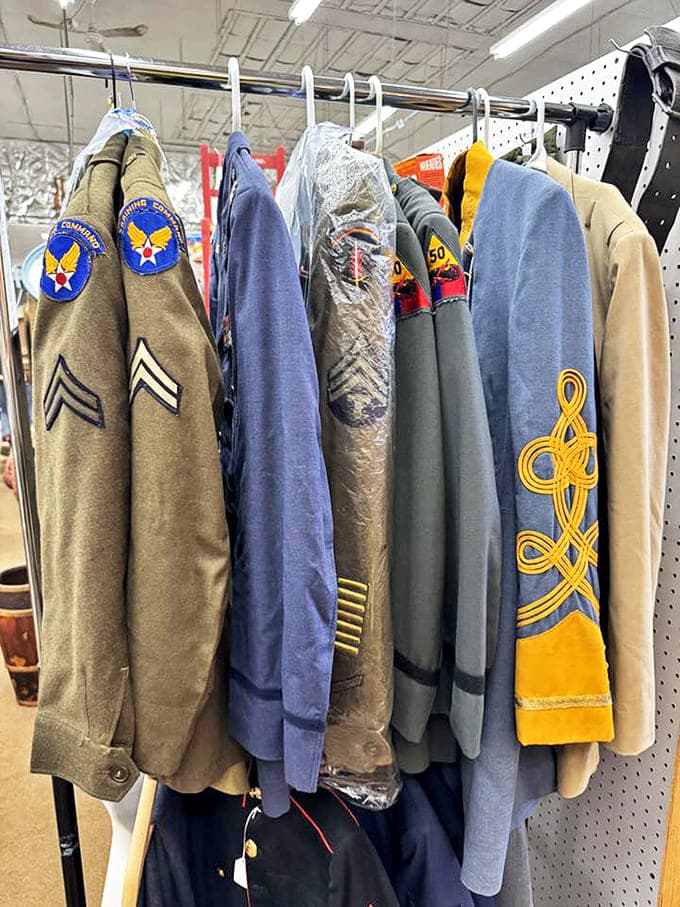 These military uniforms once stood at attention on young men serving their country, each patch and insignia telling stories of courage and duty.