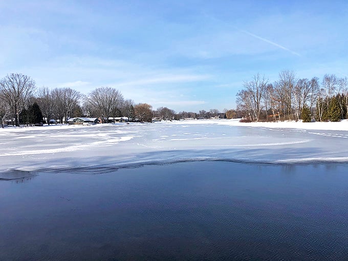 Winter transforms Clare's waterways into serene frozen landscapes that remind you why Michiganders embrace all four seasons with equal passion.