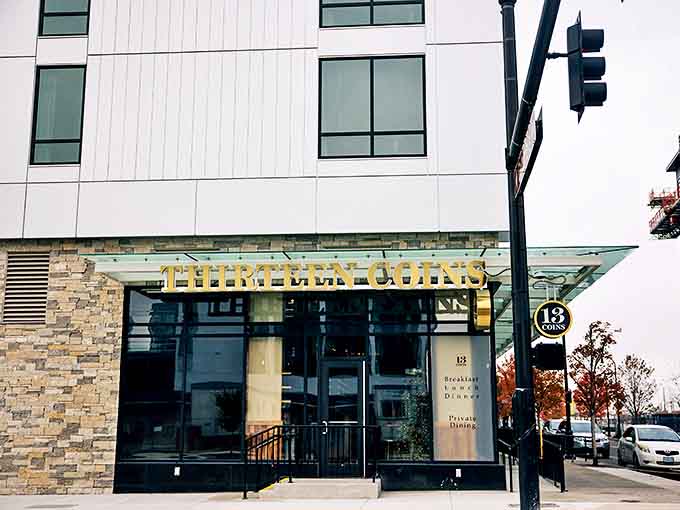 Modern meets timeless at this downtown Seattle location, where 13 Coins' golden signage shimmers against contemporary architecture like a culinary lighthouse.