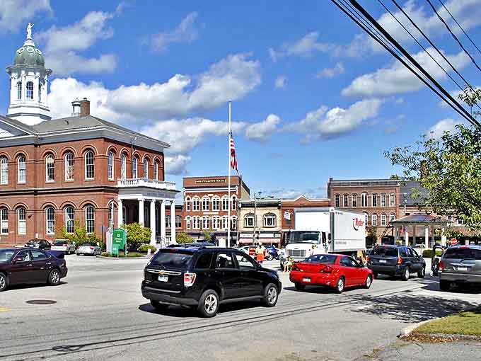 Historic brick buildings and white-domed town hall define Exeter's charming downtown under bright New Hampshire skies.