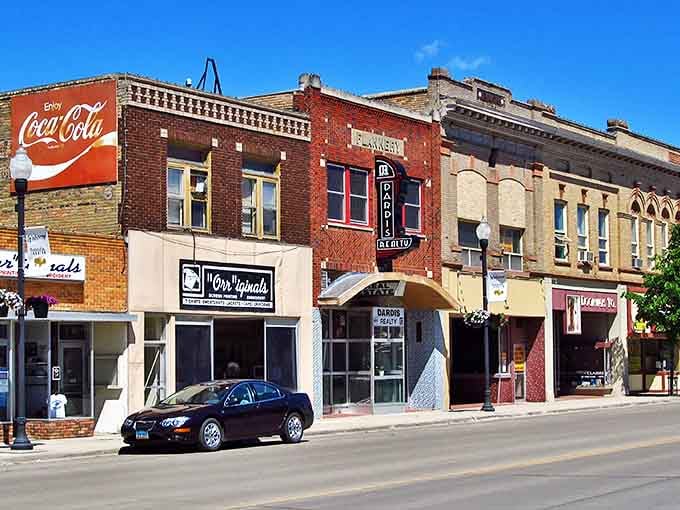 Downtown Jamestown whispers stories of simpler times, where that vintage Coca-Cola sign has watched over generations of friendly hellos.