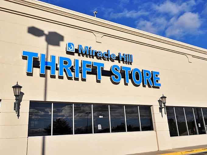 The bright blue Miracle Hill sign beckons like a lighthouse for bargain hunters. Treasure awaits inside!