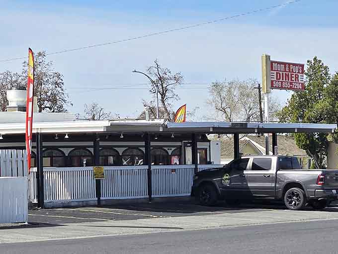 Mom and Pop's Diner stands proudly in Moses Lake, its classic white exterior promising homestyle cooking that'll make you forget your diet plans.