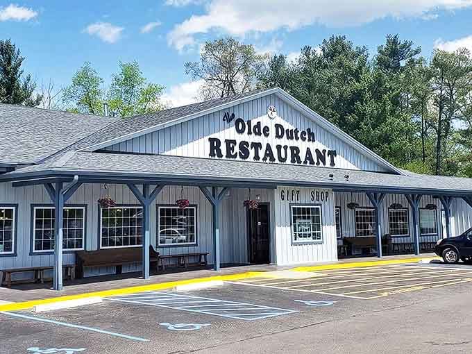 The blue-sided Olde Dutch Restaurant welcomes hungry travelers with its charming porch and promise of home-cooked abundance.