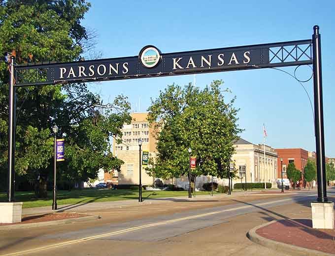 The grand welcome arch to Parsons stands like a friendly gatekeeper, inviting you into a town where everyone might just remember your name.